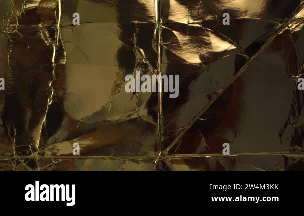 Golden paper texture, wrinkled old shiny packaging material. Light ...