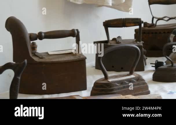 Old cast iron irons on display in the museum Stock Video Footage - Alamy