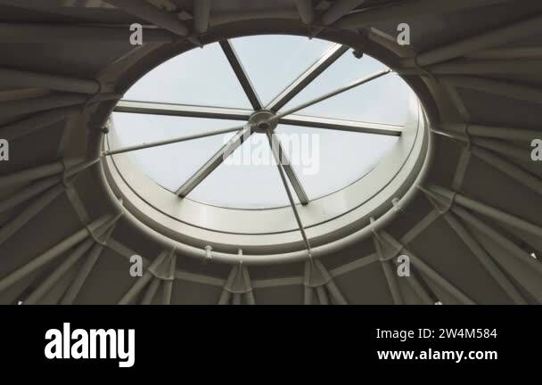 Top view on Structural glass facade curving roof of office building ...