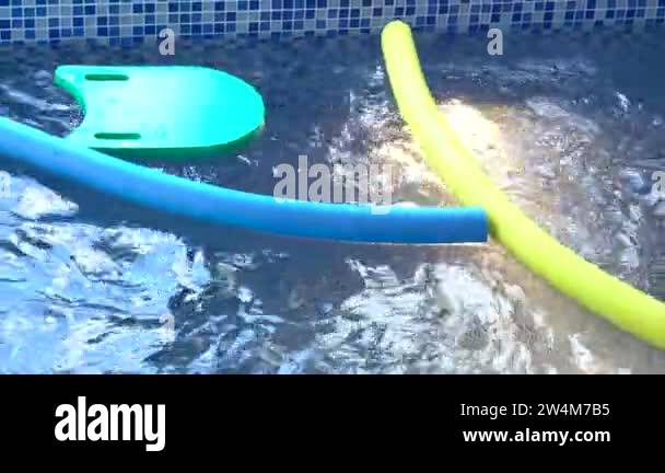 Swim noodles and pool board for teaching kids in swimming pool, aqua ...