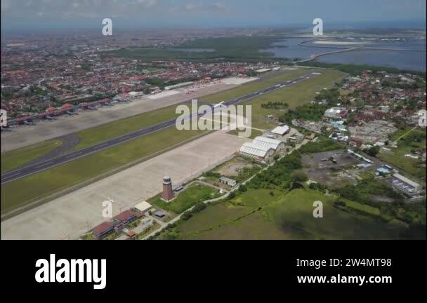 Take of a commercial aircraft from Denpasar Airport in Bali, Indonesia ...