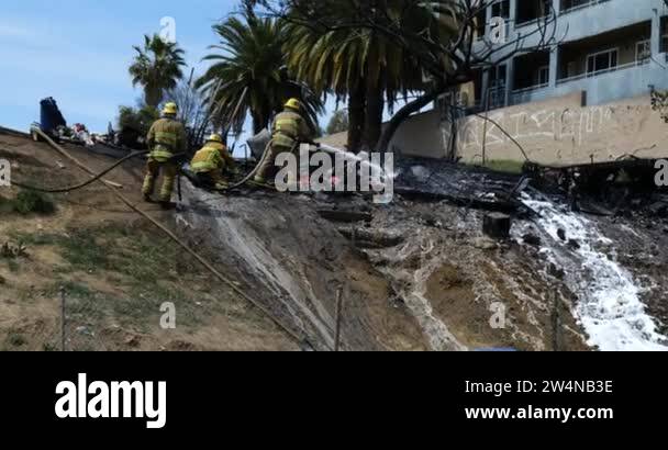 Fireman putting out building fire Stock Videos & Footage - HD and 4K ...