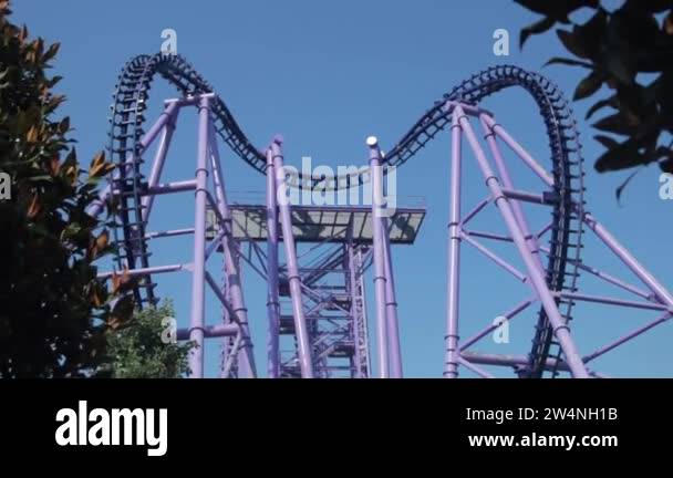 Ride on a heart shaped roller coaster on bright blue sky background ...