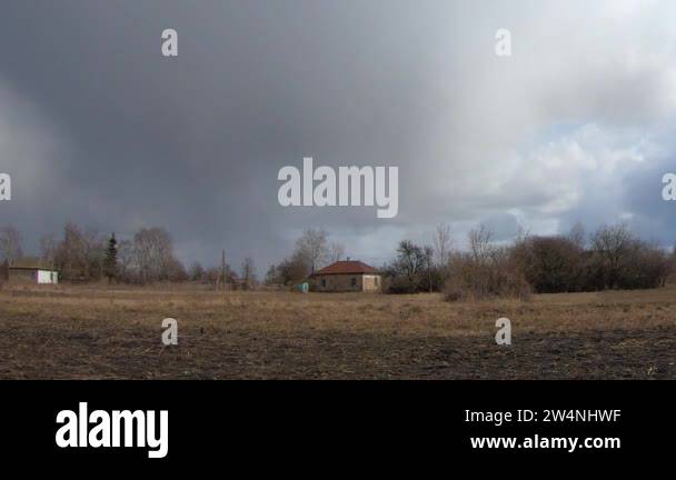 Large rain clouds in the sky over an abandoned village. Cloudy weather ...