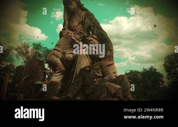 Figure of a praying angel. A very ancient stone statue. . Sad angel as ...