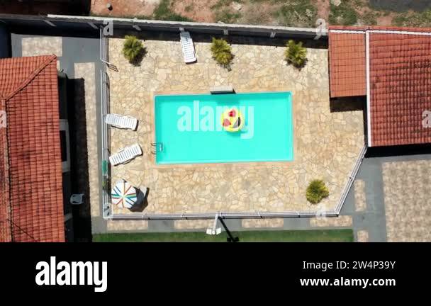 Mococa, Sao Paulo, Brazil. Smile emoji pool float scene at swimming ...