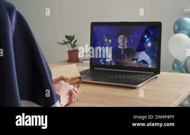 adult female student in academic dress celebrating graduation with ...