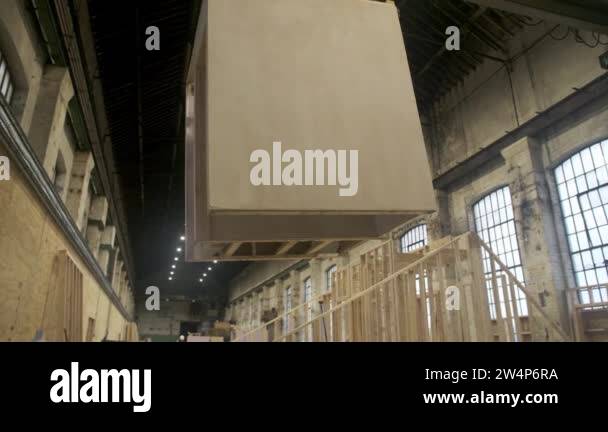 WS TS Crane moving large prefab building parts inside warehouse ...