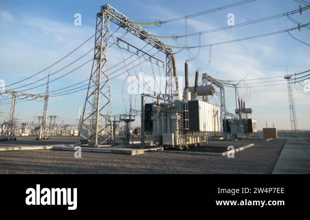 Electric power station with lofty metallic pillars and square ...