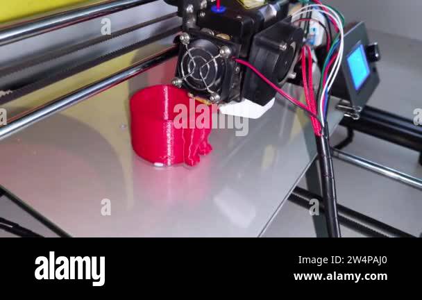 A modern 3D printer at work. Macro photography of a CNC machine that ...