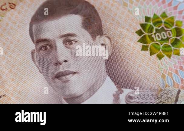 Brown 1000 baht paper banknote with face King of Thailand Maha Vajiralongkorn Stock Video ...