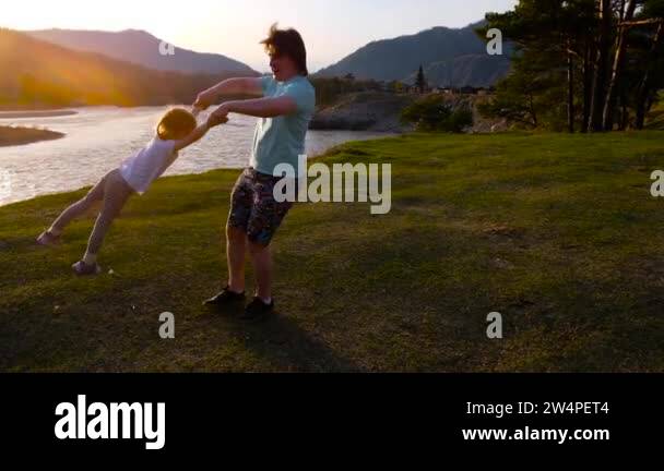 Father play with daughter and carry his child turn around with fun on ...