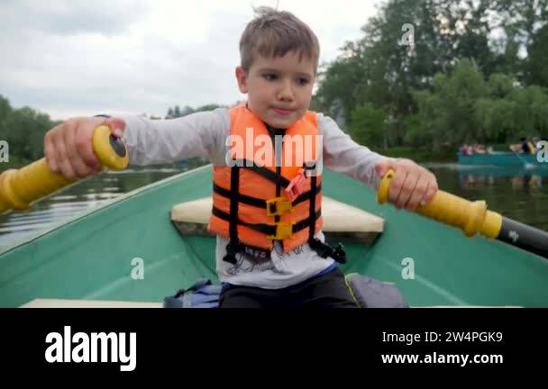 Boy rowing boat Stock Videos & Footage - HD and 4K Video Clips - Alamy