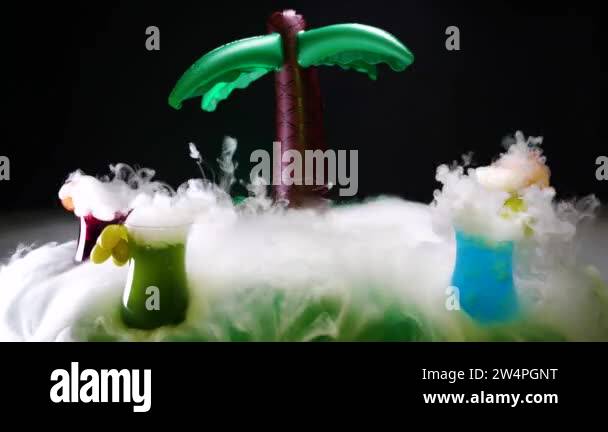 Various colorful cocktails with dry ice at beach bar with palm trees ...