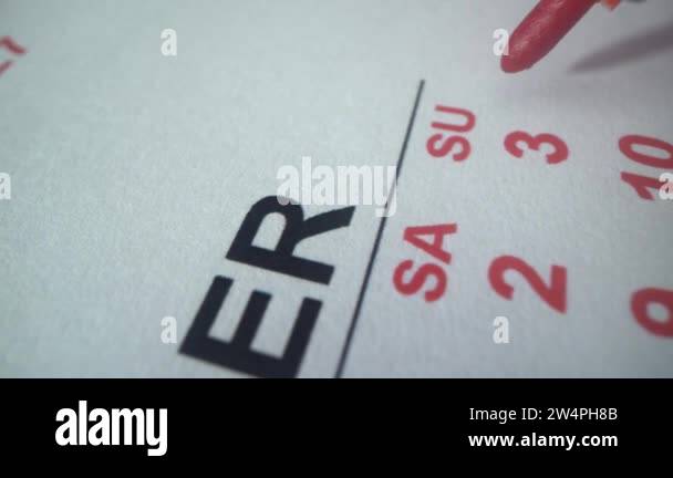 Man marks dates of weekend in calendar 2021. Macro shot. Plans for ...