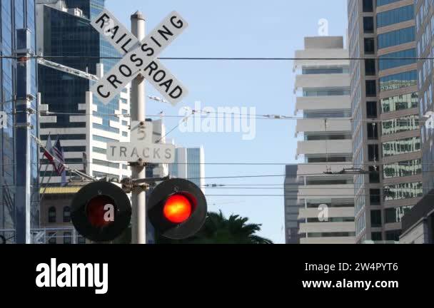 Level crossing warning signal in USA. Crossbuck notice and red traffic ...