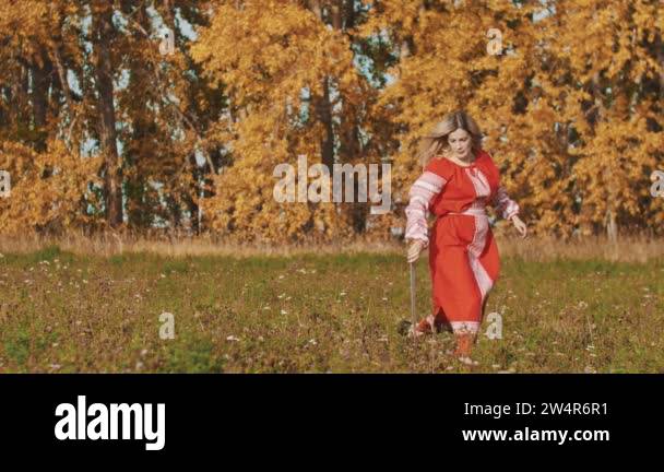 Medieval concept - woman in red national europe long dress rotating a ...