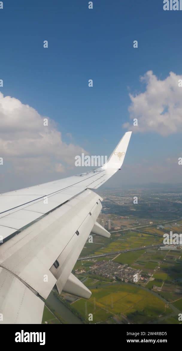 VERTICAL FOOTAGE, the passenger plane is about to land at low altitude ...