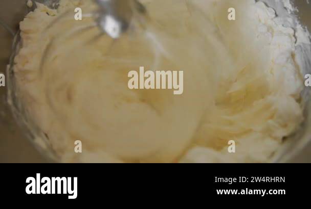 Mixer Whips Milk Cream for Cake. Professional baker preparing the cake ...