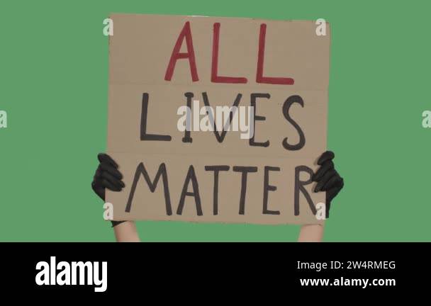 Female hands in black gloves hold a poster from a cardboard box with ...