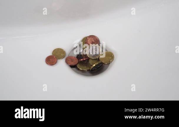 Euro coin drain Stock Videos & Footage - HD and 4K Video Clips - Alamy