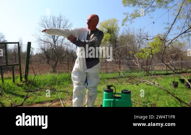 Farmer is preparing his protective clothing to dress up for protection ...