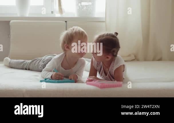 family, innocence, infant concepts - Two children draw write with ...