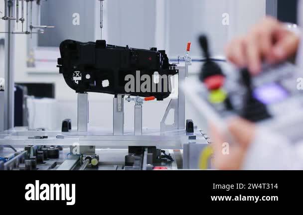 Professional quality engineer measuring on the 3D measurement machine ...