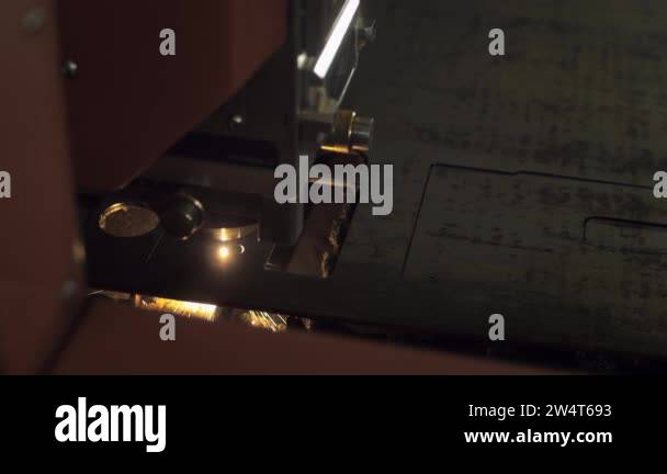 Laser cutting of metal. An industrial machine with a powerful luminous ...