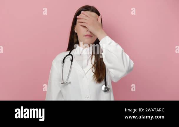 Close up portrait of frustrated unhappy sad young doctor woman in white ...