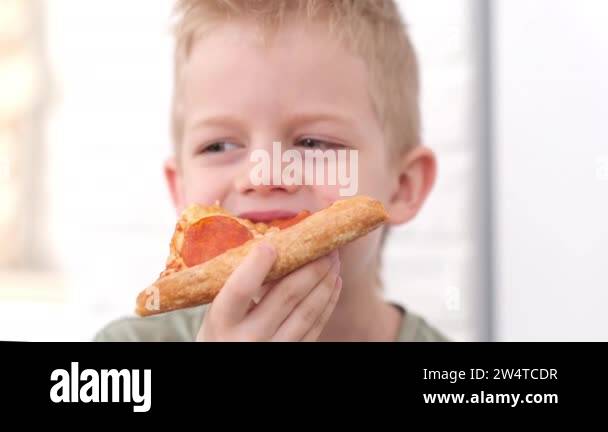 Portrait blonde boy Eating cheese Pizza Smiling close up .Happy Child ...