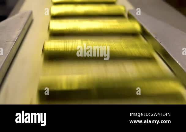 Chocolate confectionery products are moved along the conveyor of the ...