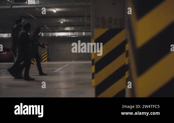 Over-the-columns full side-view footage of multi-ethnic group of armed ...