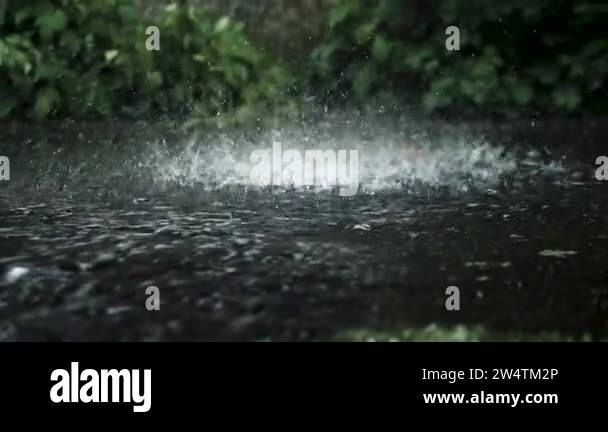 A strong stream of water, a thunderstorm, rain washes over the earth. A ...