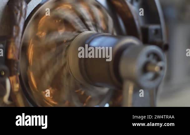 The mechanism of an induction motor inside in motion in a disassembled ...