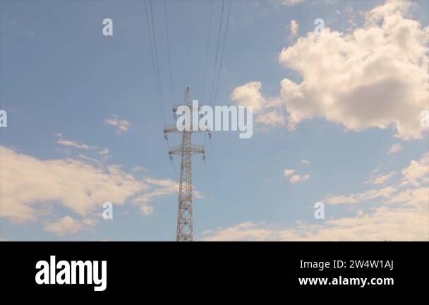 Electricity transportation line. High-voltage tower. Beautiful clouds ...
