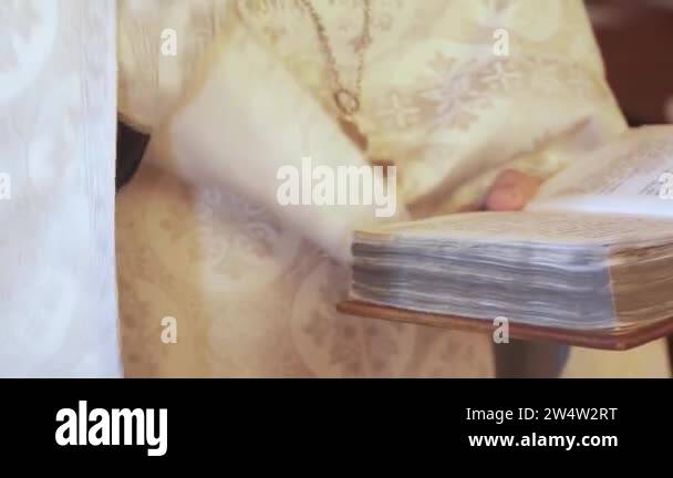 The priest makes the sign of the baptism Stock Video Footage - Alamy