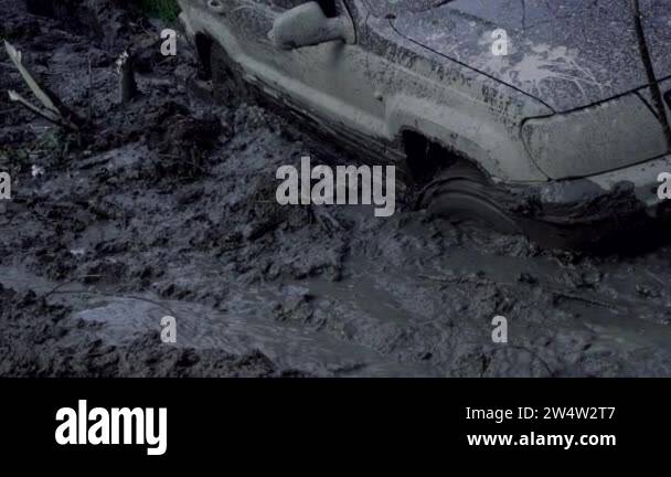Wheel of the car in the mud. Offroad car on bad road. Tire on a dirt ...