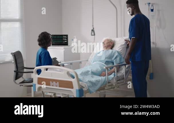 A team of african ethnic group doctors a man and a woman talk to an ...