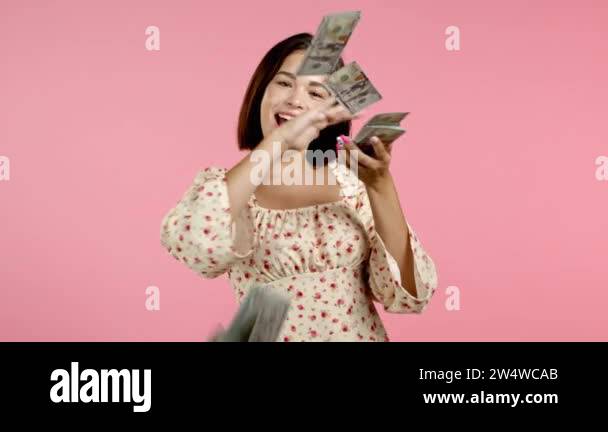 Pretty woman with happy face scatters, waste money. Girl overspend US ...