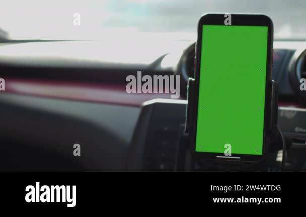 Phone on Car Dashboard Green Screen, Smartphone with a green screen is ...