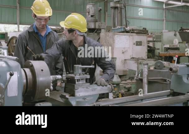 Engineer man training with foreman for apprentice using lathe ...