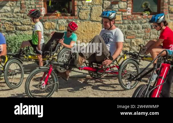 People are sitting in recumbent bicycles and are waiting to start ...