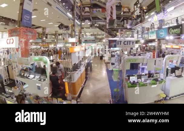 Electronic gadget kiosks at the bottom floor of a big shopping mall in downtown. Bangkok ...