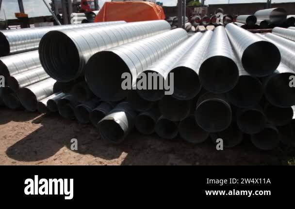 Ventilation pipe warehouse. Steel pipes, parts for the construction of ...