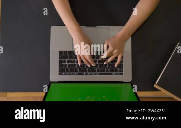 Top view Laptop computer is on table with green screen. Chroma key ...