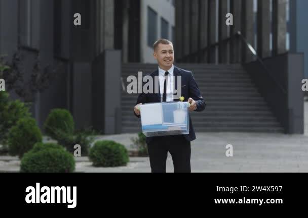 Young happy businessman returns to work after vacation. New employee on ...