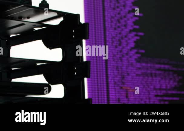 Violet Computer Software Code Moving On A Black Monitor Reflect On Glass Abstract Computer