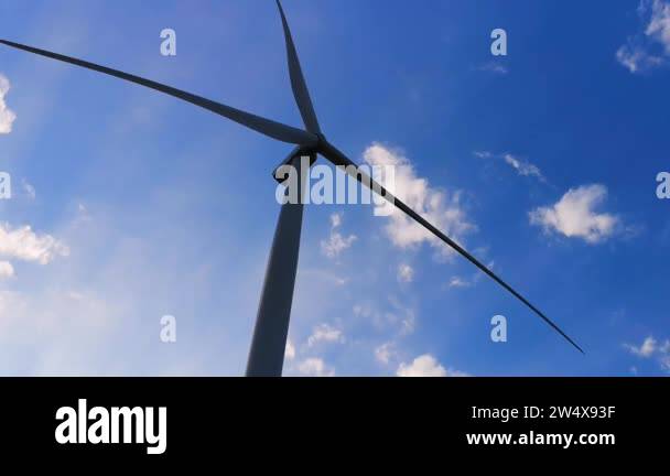 Rotating wind turbine. Green clean energy future concept. Windmill ...