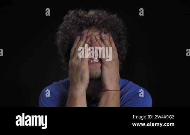 Young artistic guy depicts the emotion of embittered fatigue. Hes fed ...